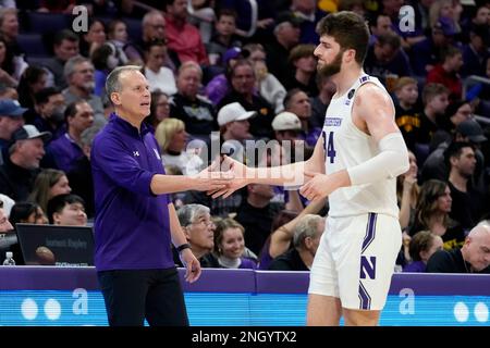 Northwestern center Matthew Nicholson, center, celebrates with fans ...