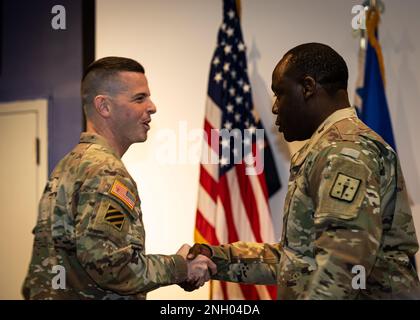 Command Sgt. Maj. Tracy L. Jones (center) passes the colors after ...