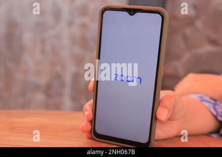 Surabaya, Indonesia - May 20, 2021: Hand held smartphone with zoom ...