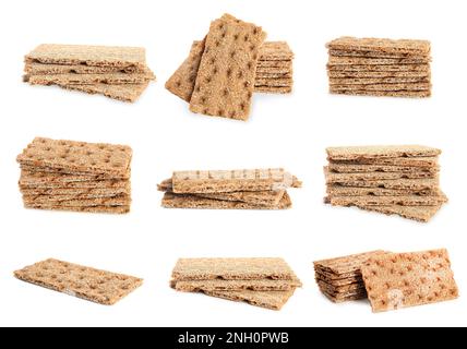 Set with fresh crunchy rye crispbreads on white background, top view ...