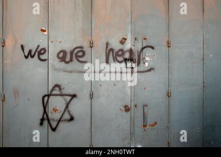 A graffiti in Hebrew sprayed by extreme anti-Zionist Haredi Jews ...