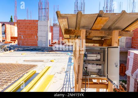 Industrial sockets and plug on distribution board. Construction site electricity, temporary ...