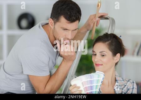 The young family planning home refurbishing in diy concept Stock Photo ...