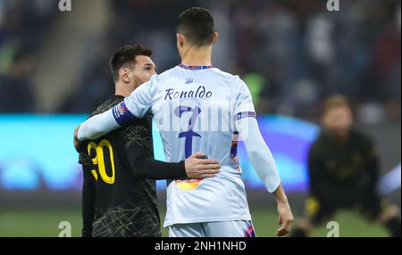 Lionel Messi (L) and Cristiano Ronaldo great each other prior Riyadh All-Star XI vs Paris Saint ...