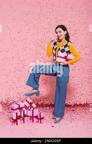 Beautiful confetti and ribbons on blue background Stock Photo - Alamy