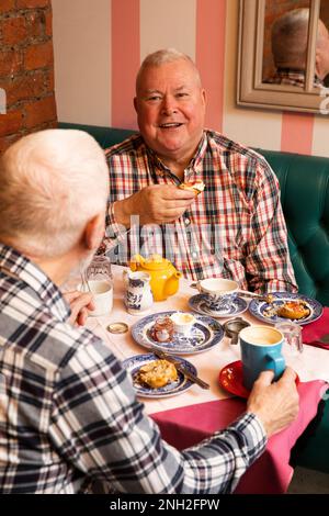Two men in a cafe. Manchester. United Kingdom Stock Photo - Alamy