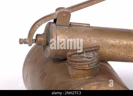 Old brass insecticide spray on a white background Stock Photo - Alamy