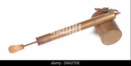 Old brass insecticide spray on a white background Stock Photo - Alamy