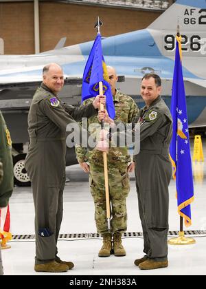 Col. Sean Rassas, 926th Wing commander, cuts a cake with Airman Yulissa ...