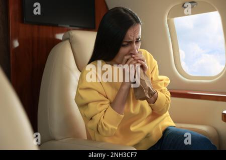 Anxiety, breathing and scared woman with paper bag, mental health and ...