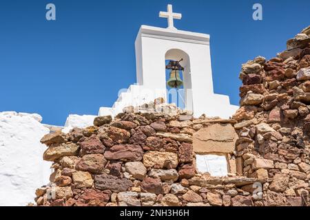Whitewashed bell tower among the Venetian castle of Chorio ruins ...