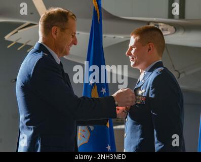 An Officer Presents The Distinguished Flying Cross To A Member Of The ...