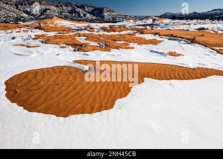 Snow on Coral Pink Sand Dunes. Blowing snow and drifting sand create ...
