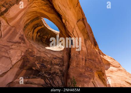 Cummings Arch is a pothole arch south of Moab, Utah. A pothole arch has ...