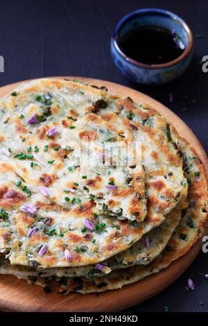 Homemade appetizing scallion pancakes served with soy sauce Stock Photo ...