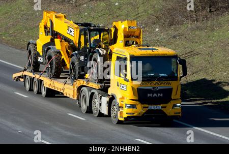 JCB low loader lorry on the M40 motorway, Warwickshire, England, UK ...