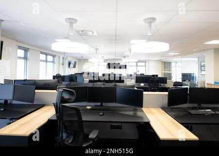 Empty office room with computers and desks Stock Photo - Alamy