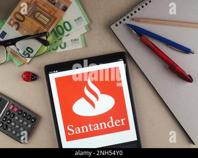 In this photo illustration, Santander Group logo seen displayed on a ...