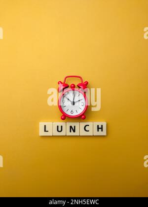Alarm clock and words Lunch Time on white background Stock Photo - Alamy