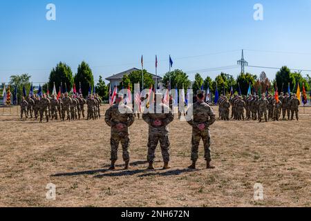U.S. Soldiers from the 102d Signal Battalion attend a change of command ...