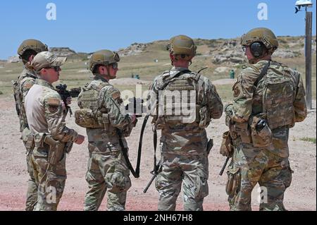 An 890th Missile Security Forces Squadron security forces member reloads his M249 machine gun ...