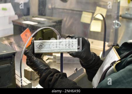A Crane Army Ammunition Activity explosives handler displays a warning ...