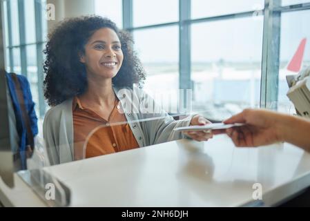 Ticket, glass window and black woman at airport or theatre with paper ...