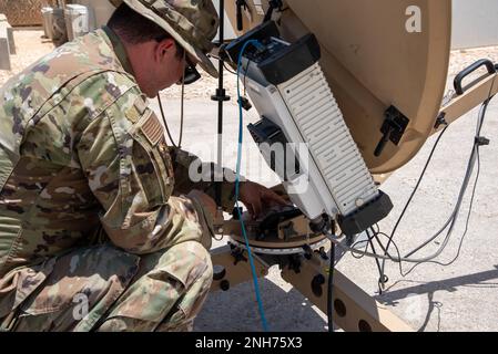 Airman 1st Class Nathan Ammons operates a Communications Fly Away Kit ...