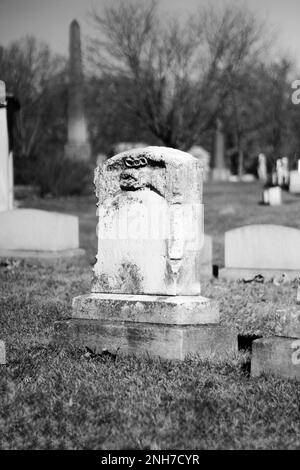 Typical common worn and weathered limestone tombstone with a blank ...