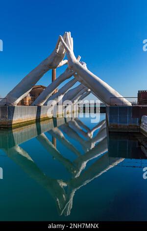 Building Bridges sculpture by artist Lorenzo Quinn depicting 6 pairs of ...