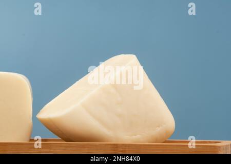 Minas half-cured cheese on a bamboo tray in color background Stock ...
