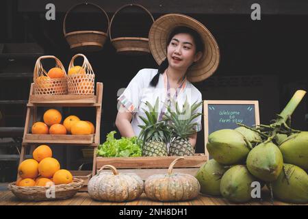 Indigenous Asian women with a natural assortment of fruits welcome ...
