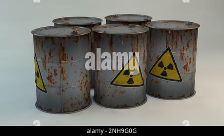 Rusty old gray iron barrels with a radiation hazard sign and a green ...