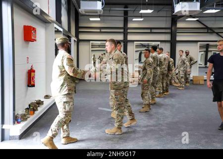 New equipment is moved inside the new gym at Drawsko Pomorskie Training ...