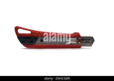 Used red snap-off utility knife with blade out isolated on white ...