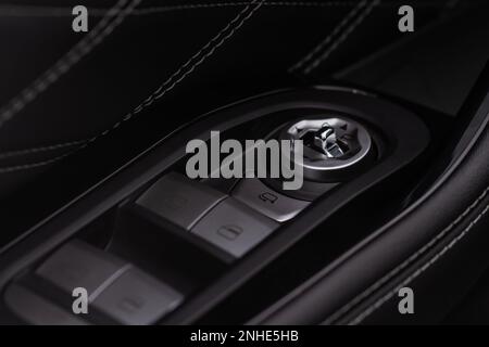 Side mirrors control panel on side door. Car driver adjust side mirror ...