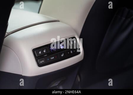 Modern car. Digital second row seat temperature control. Car air ...