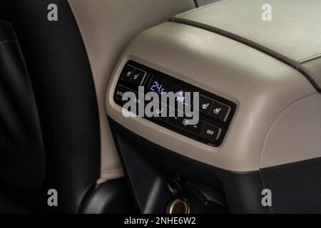 Modern car. Digital second row seat temperature control. Car air ...