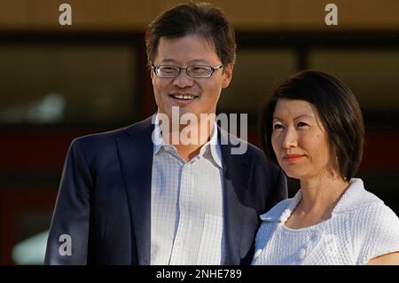 Yahoo CEO, Jerry Yang and his wife Akiko Yamazaki listening to speakers ...