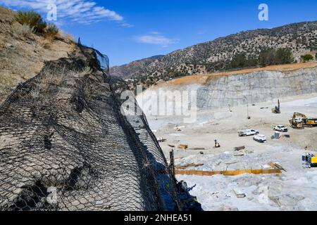 Netting secures the sides of the emergency spillway at the Isabella Dam ...