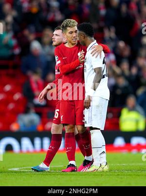Real Madrid's Vinicius Junior, left, is challenged by Arsenal's Jurrien ...