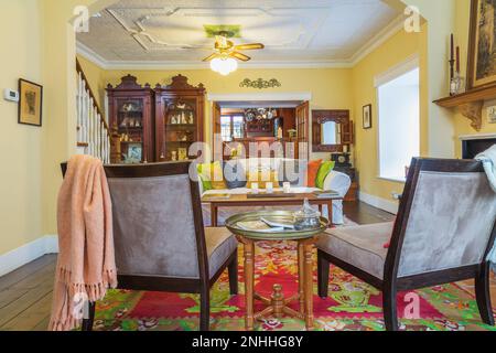 Eclectic furnishings in living room Stock Photo - Alamy