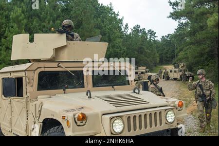 Soldiers from the 290th Military Police Brigade fire the FN 303 during ...