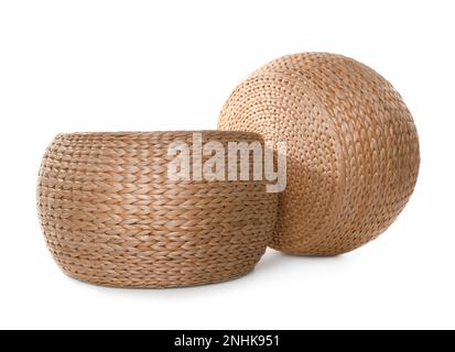 Two stylish wicker poufs on white background Stock Photo - Alamy