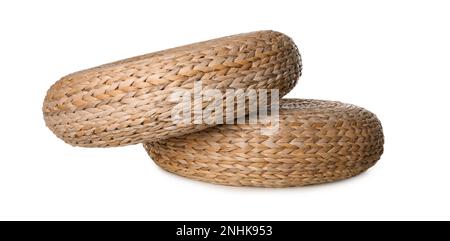 Two stylish wicker poufs on white background Stock Photo - Alamy
