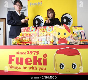 Employees of Fuekinori Kogyo Co. show off its glue character, 'Fueki ...