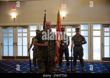 U.S. Marine Col. Todd Manyx, right, passes a guidon to Col. Rory Kent ...