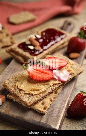 Fresh rye crispbreads with different toppings on white background ...