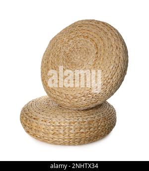 Two stylish wicker poufs on white background Stock Photo - Alamy