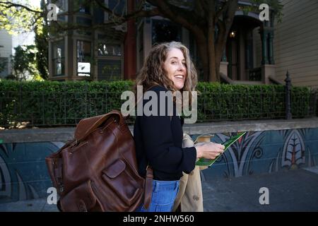 Irish history expert Elizabeth Creely shows a map of her walking tour ...